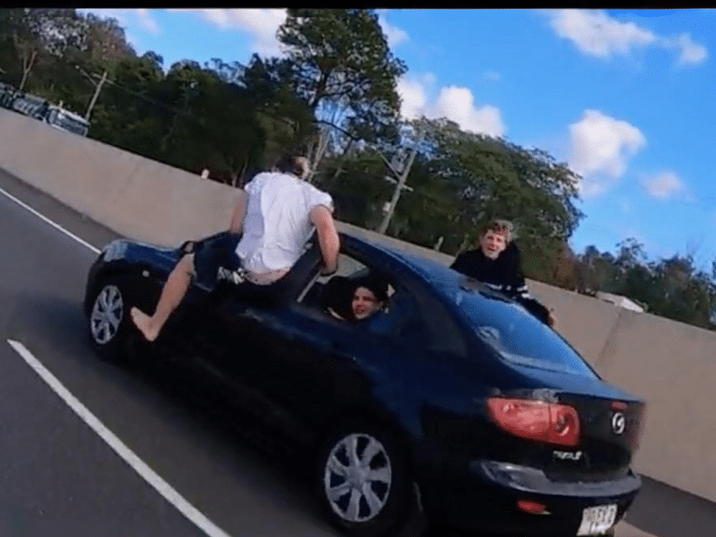 Daredevil Teens Hang Out of Moving Car, High-Fiving Motorists on Aussie ...